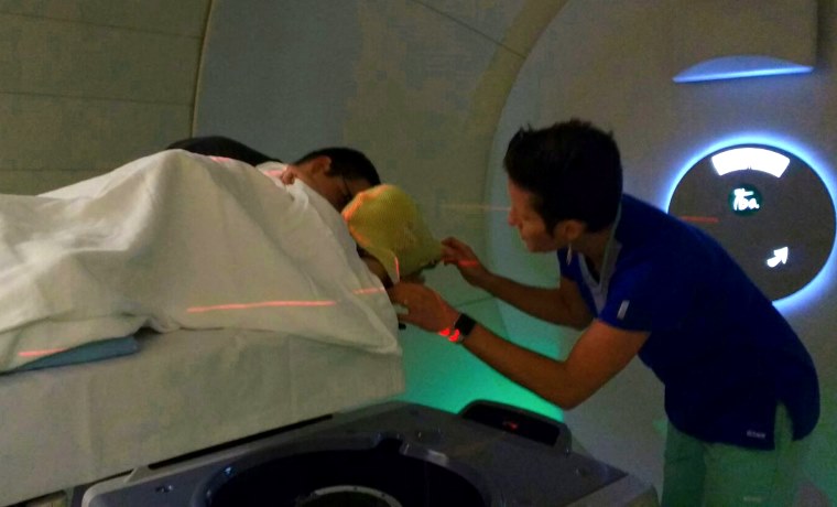 Proton beam radiotherapy face mask being fitted